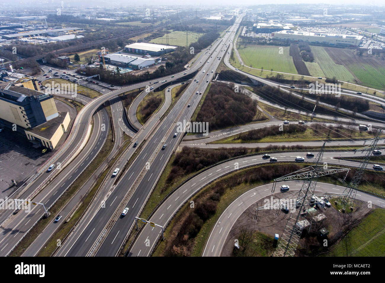 Aerial view of a highway intersection with a clover-leaf interchange in ...