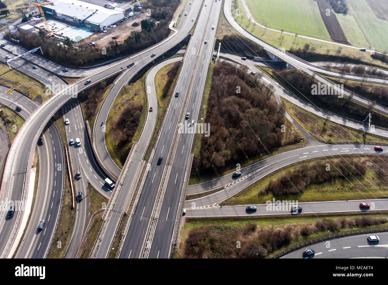 Aerial view of a highway intersection with a clover-leaf interchange in ...