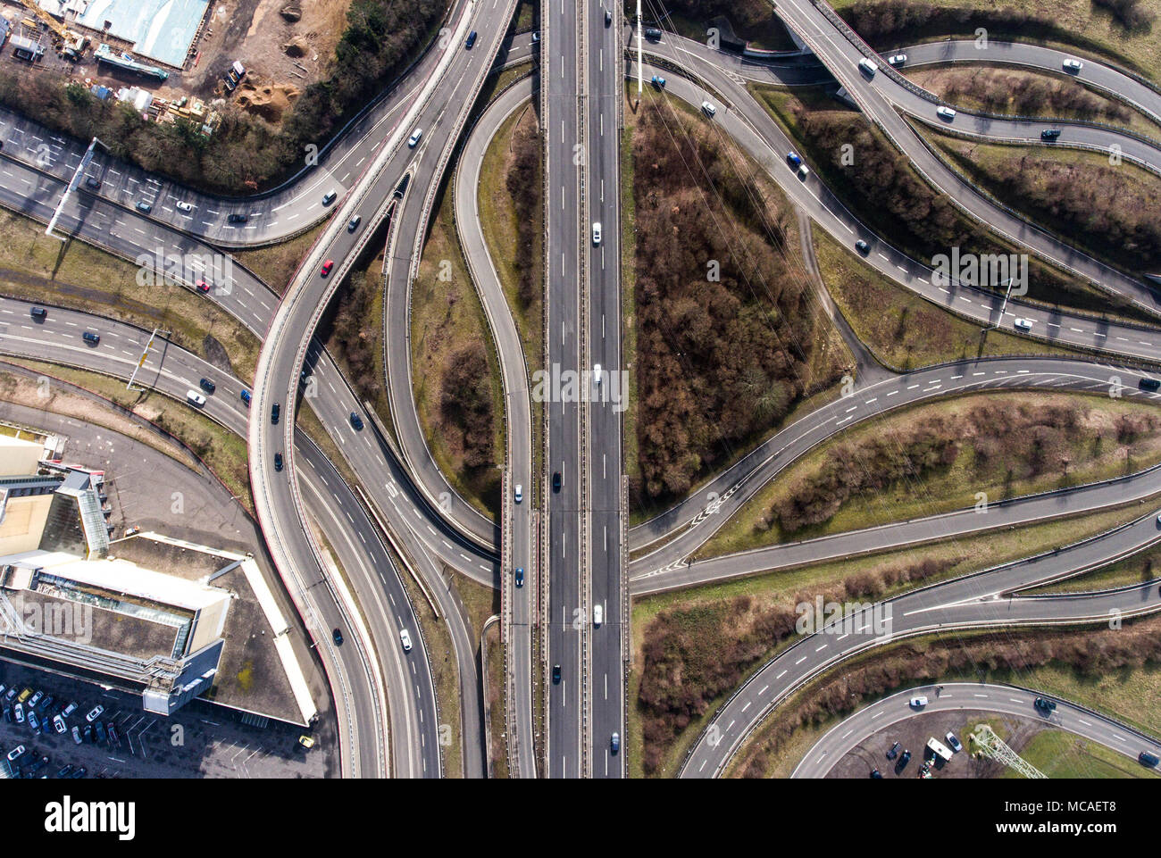 Aerial view of a highway intersection with a clover-leaf interchange in ...