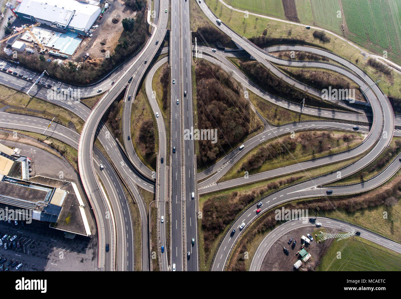 Aerial view of a highway intersection with a clover-leaf interchange in ...