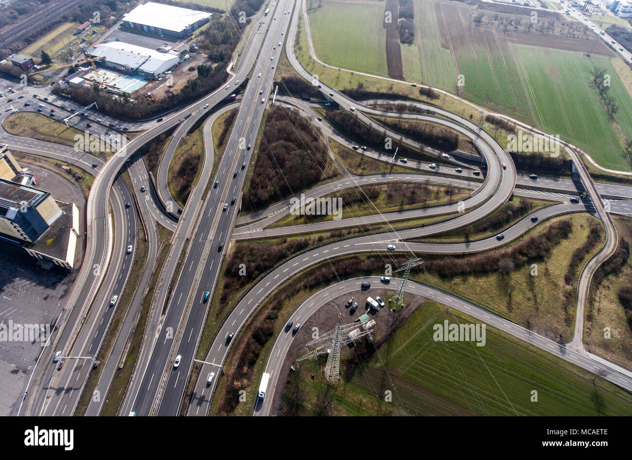 Aerial view of a highway intersection with a clover-leaf interchange in ...