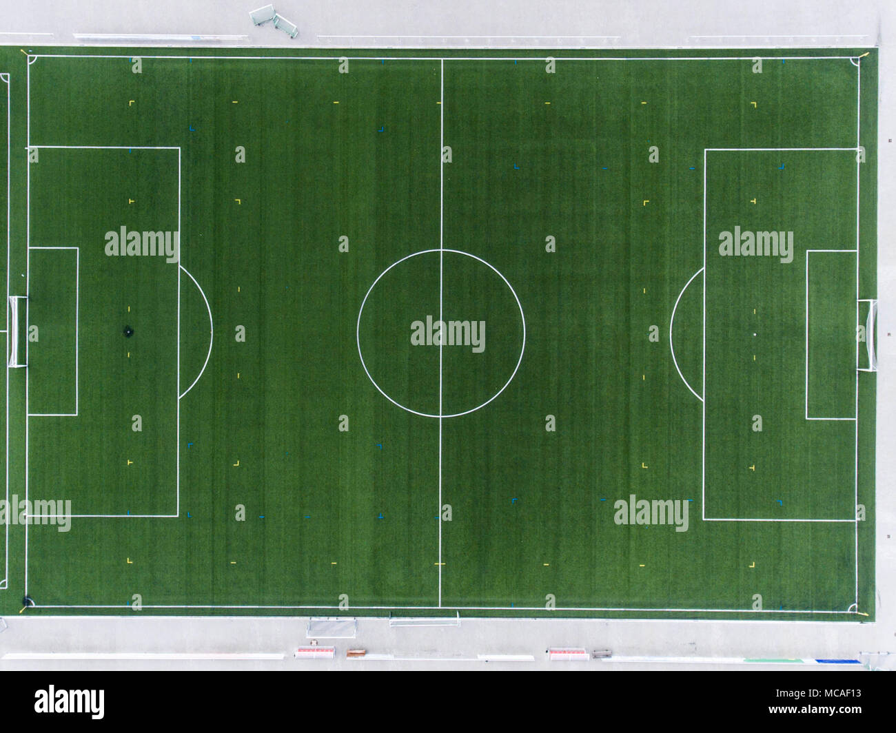 Aerial view of a smal sports soccer football field in village near ...