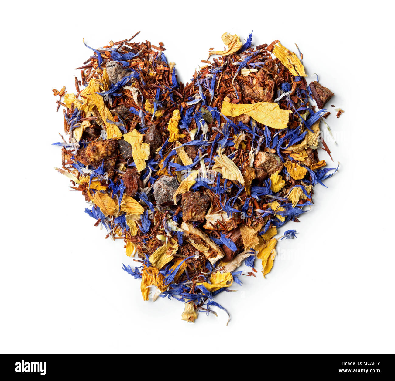 Heart shaped from rooibos tea with cornflower and orange slices ...