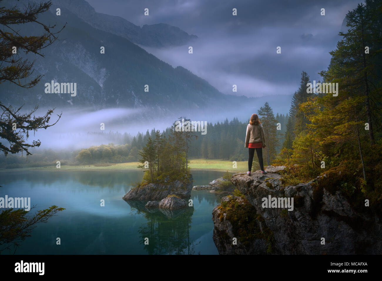 Beautiful landcape view on Lake - Laghi di Fusine at idyllic misty dawn ...