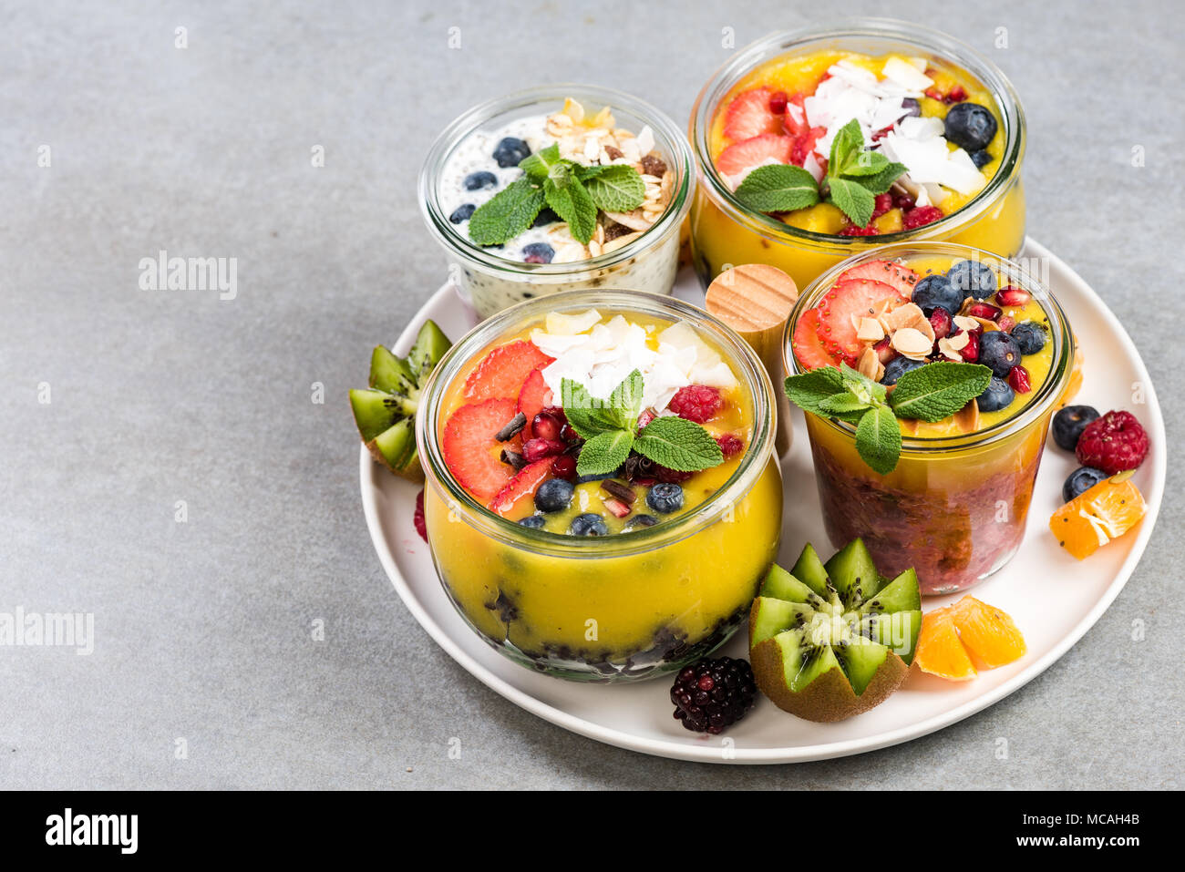 Serving tray with layered food in jars Stock Photo - Alamy