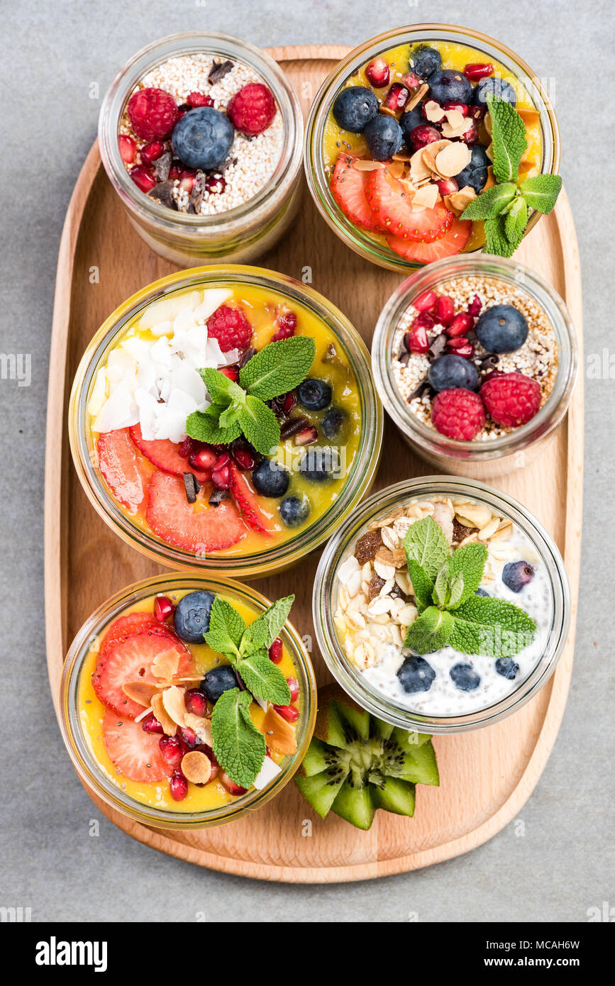 Ripe fruits and superfoods jars, layered food Stock Photo - Alamy