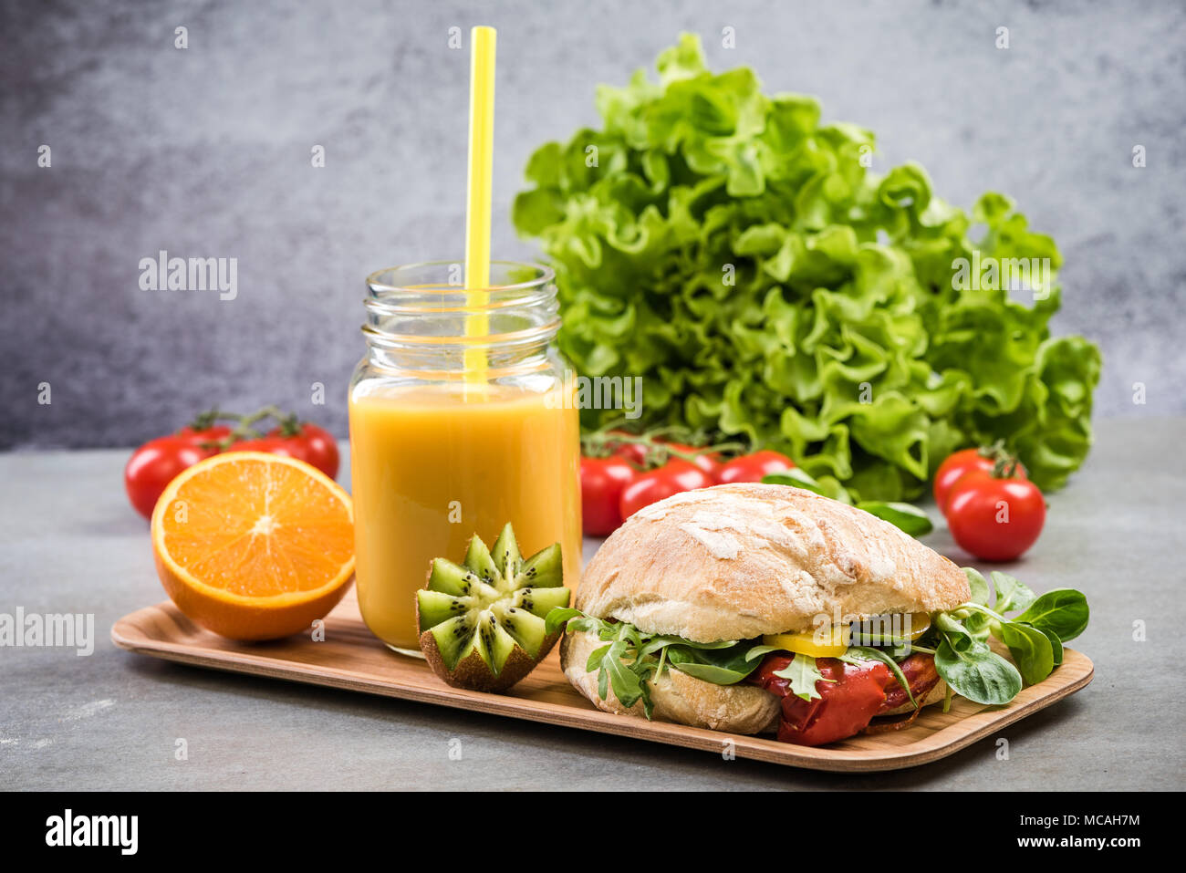 Healthy sandwich bun,smoothie on breakfast tray Stock Photo - Alamy