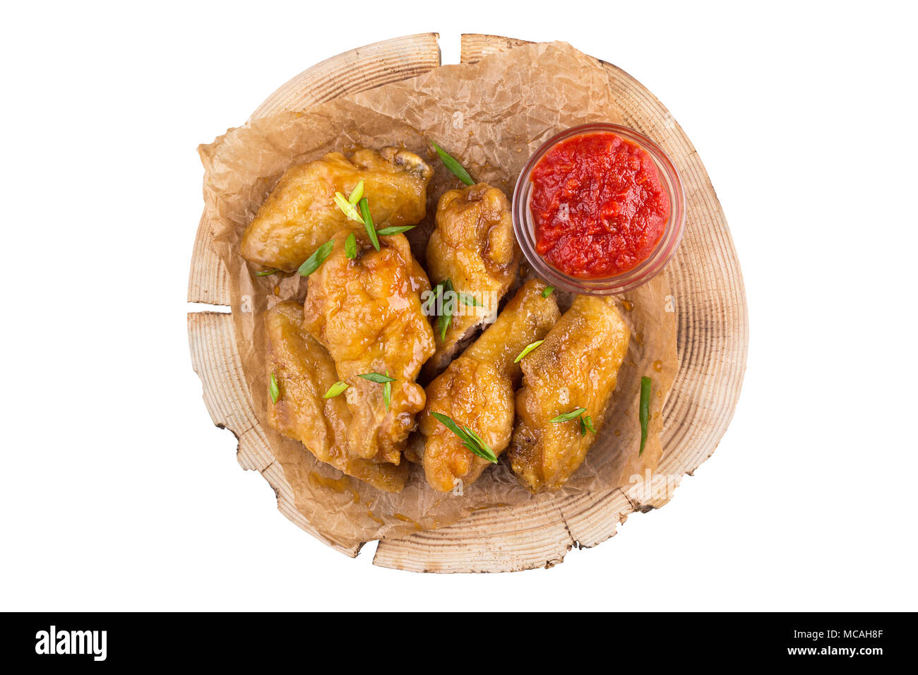 Appetizing chicken wings on a grill on a white background top view ...