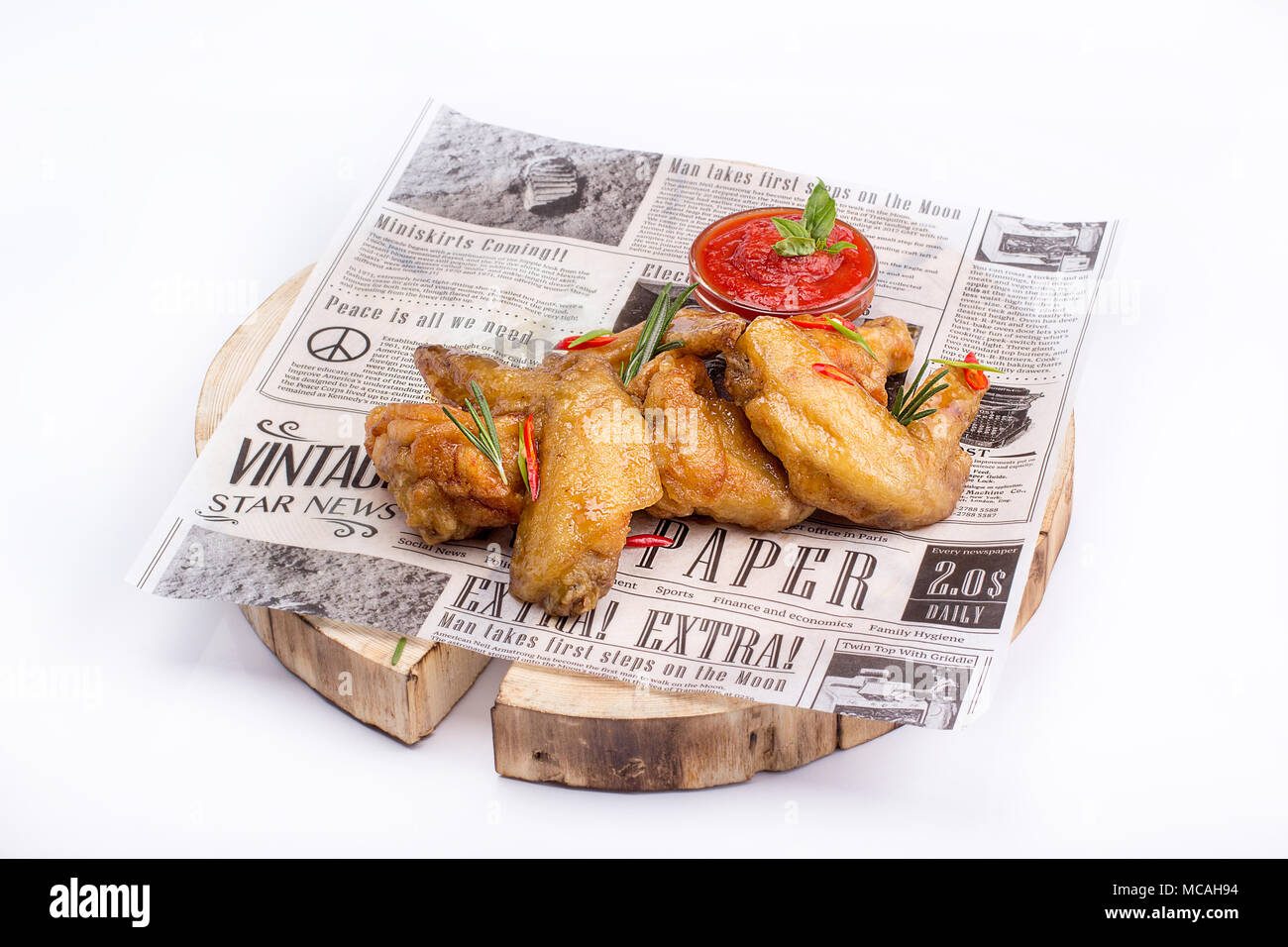 Appetizing chicken wings on the grill on a white background side view ...