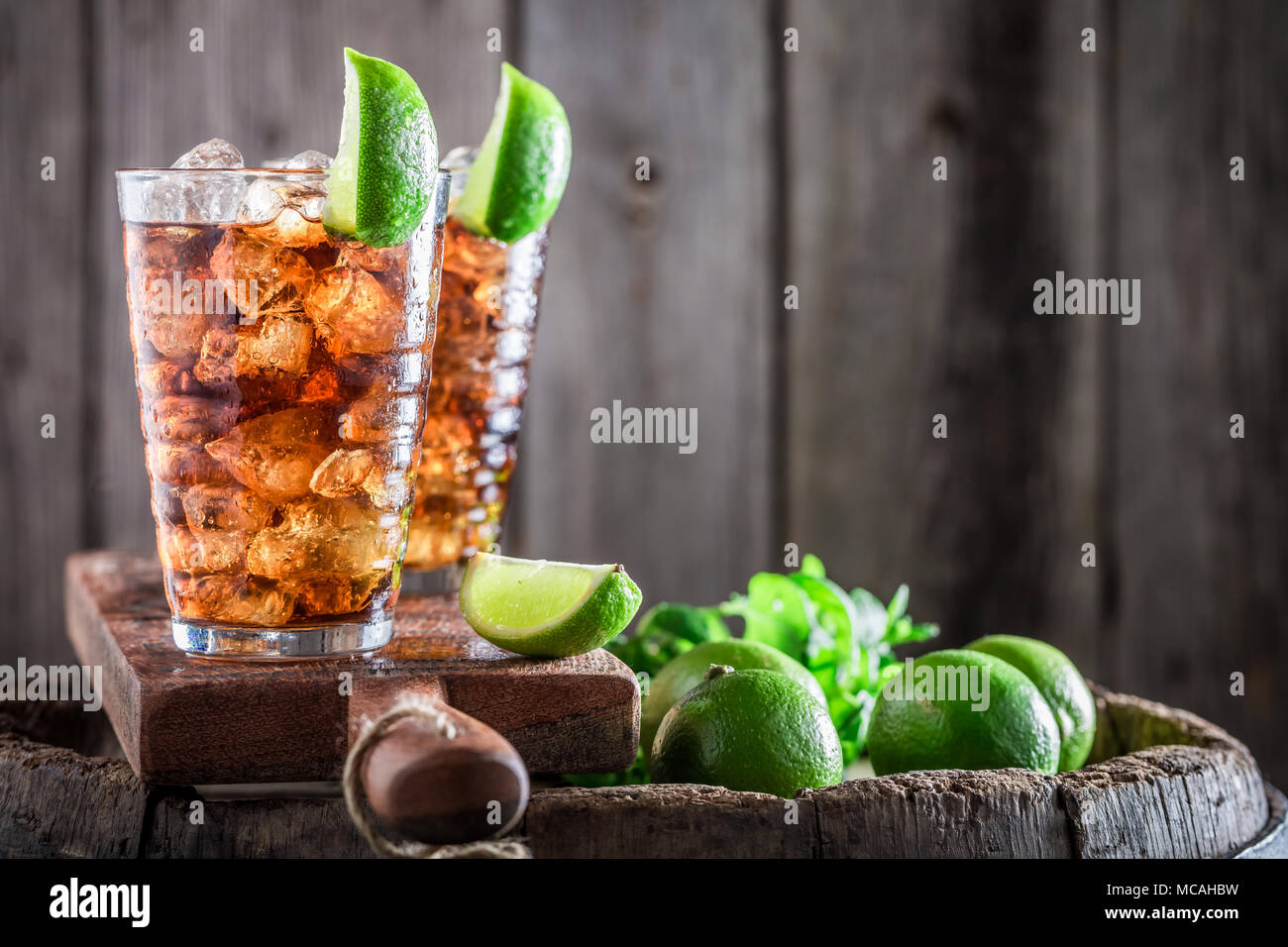 Cold and tasty iced tea on old barrel Stock Photo - Alamy