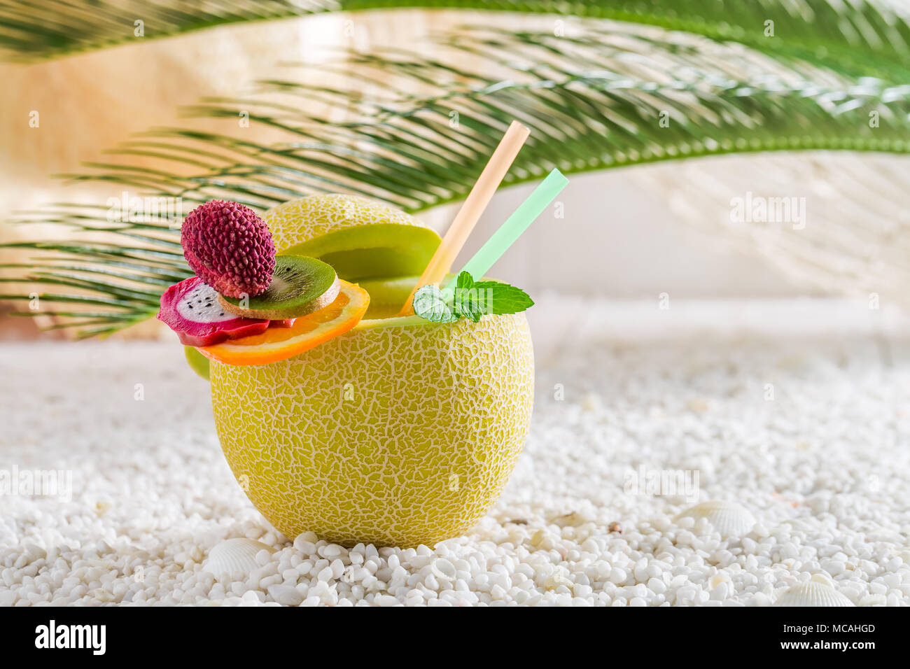 Delicious drinks in fresh fruits on white pebbles Stock Photo - Alamy