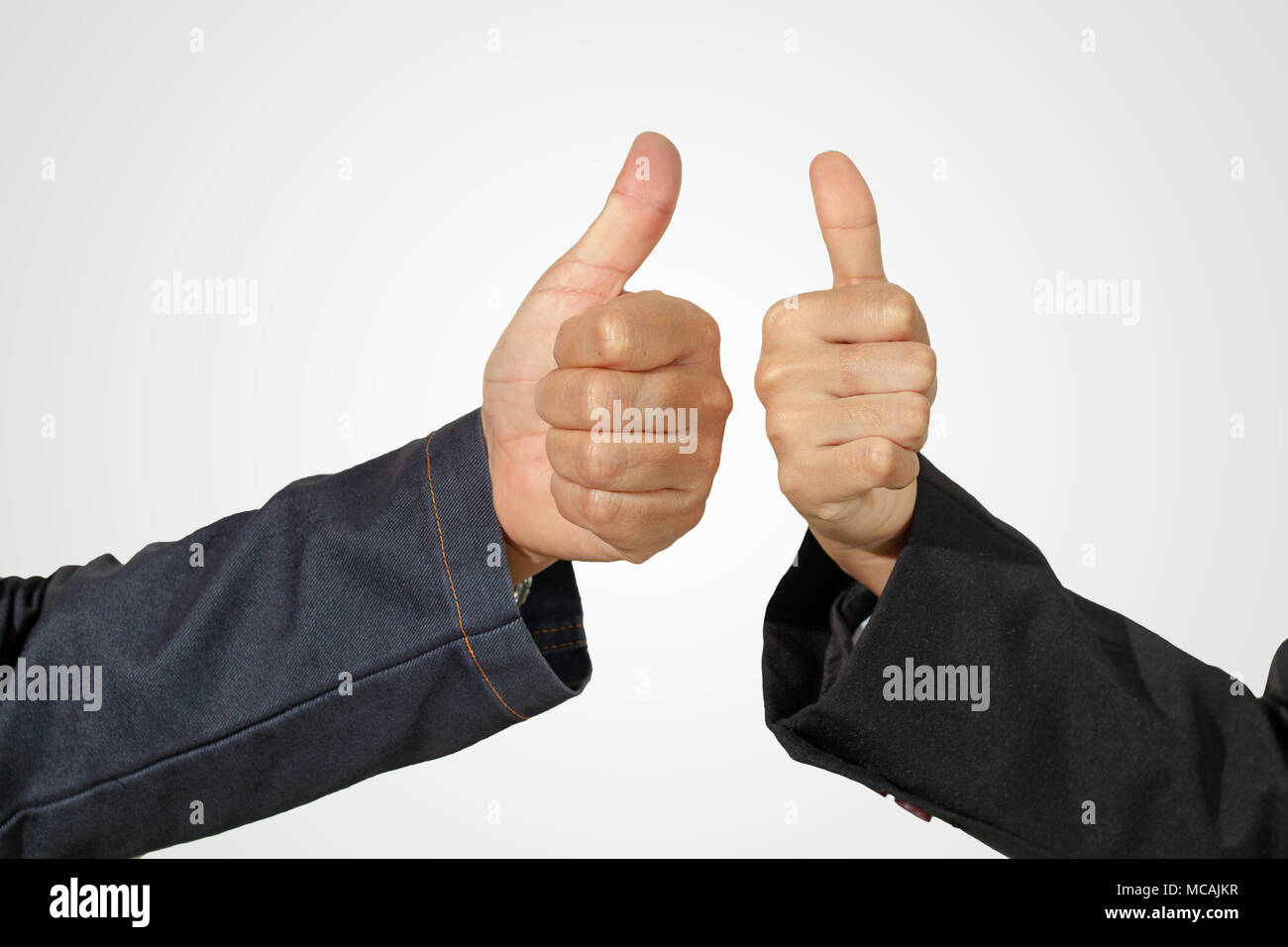 Thump up hand sign isolated on white Stock Photo - Alamy