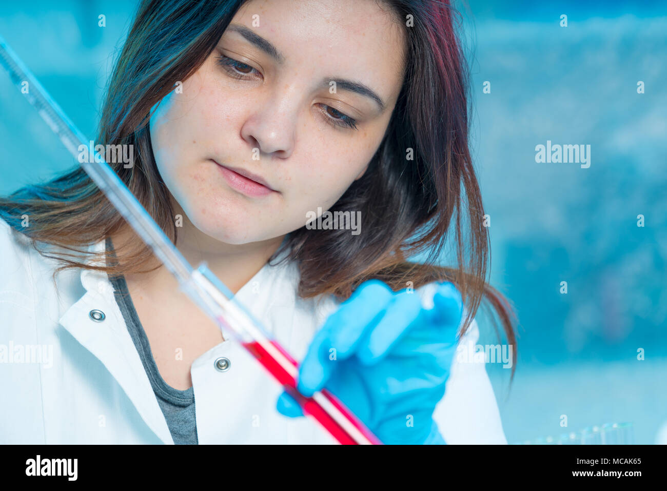 Scientist mixing chemicals hi-res stock photography and images - Alamy