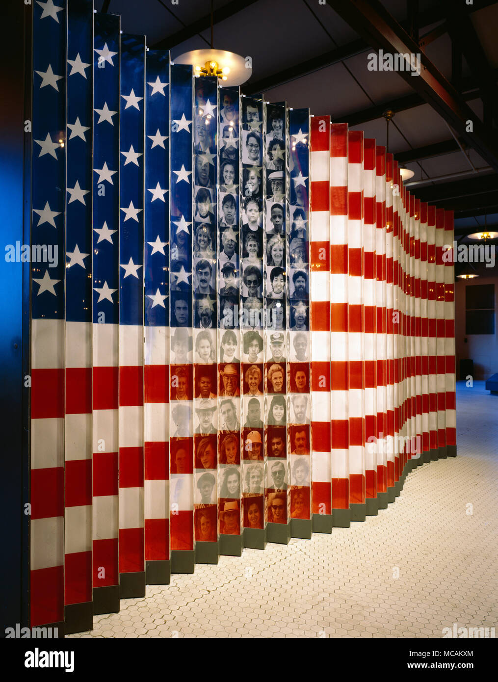Ellis Island flag and faces exhibit photographs Stock Photo - Alamy