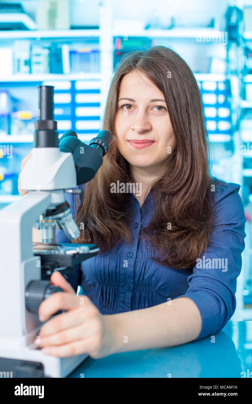 Girl student in university laboratory with microscope Stock Photo - Alamy