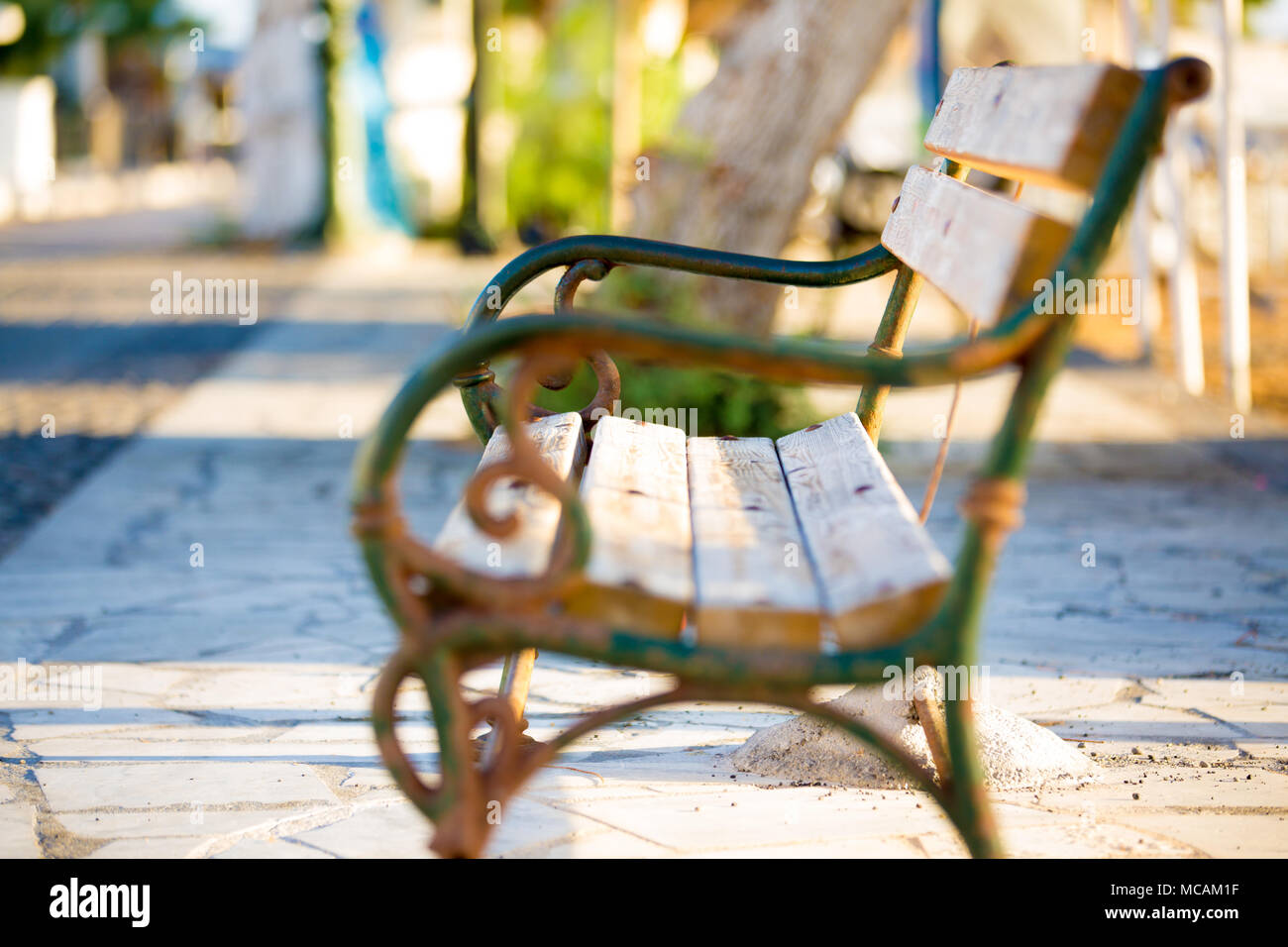Ancient wooden bench made of cast iron Stock Photo - Alamy