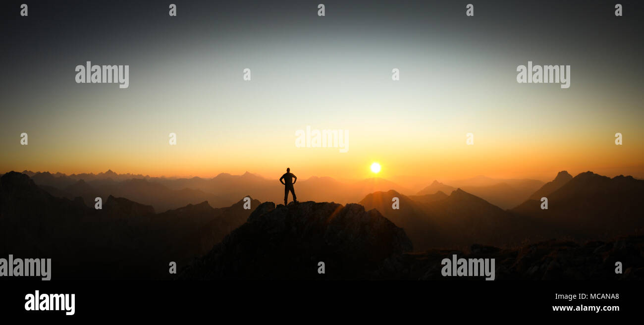 Man looking sunset mountains hi-res stock photography and images - Alamy