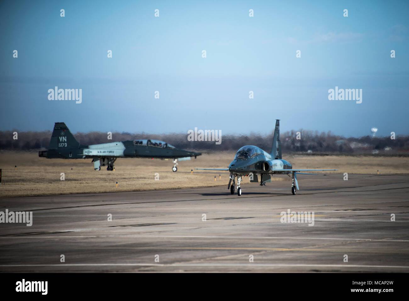 Two T-38C Talons from the 25th Flying Training Squadron taxi on the ...