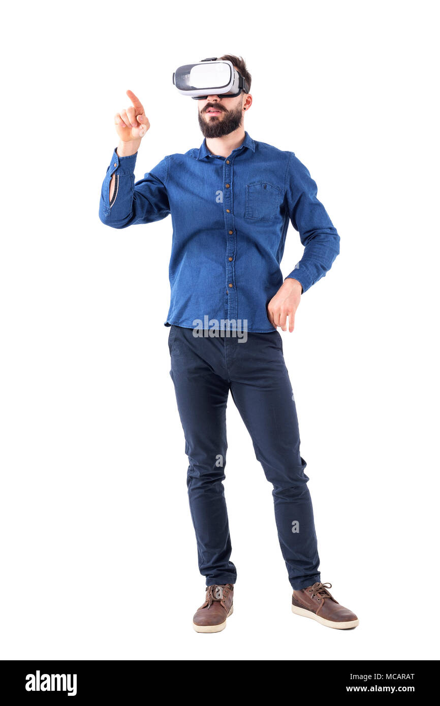 Young adult businessman wearing vr glasses interacting with touch ...