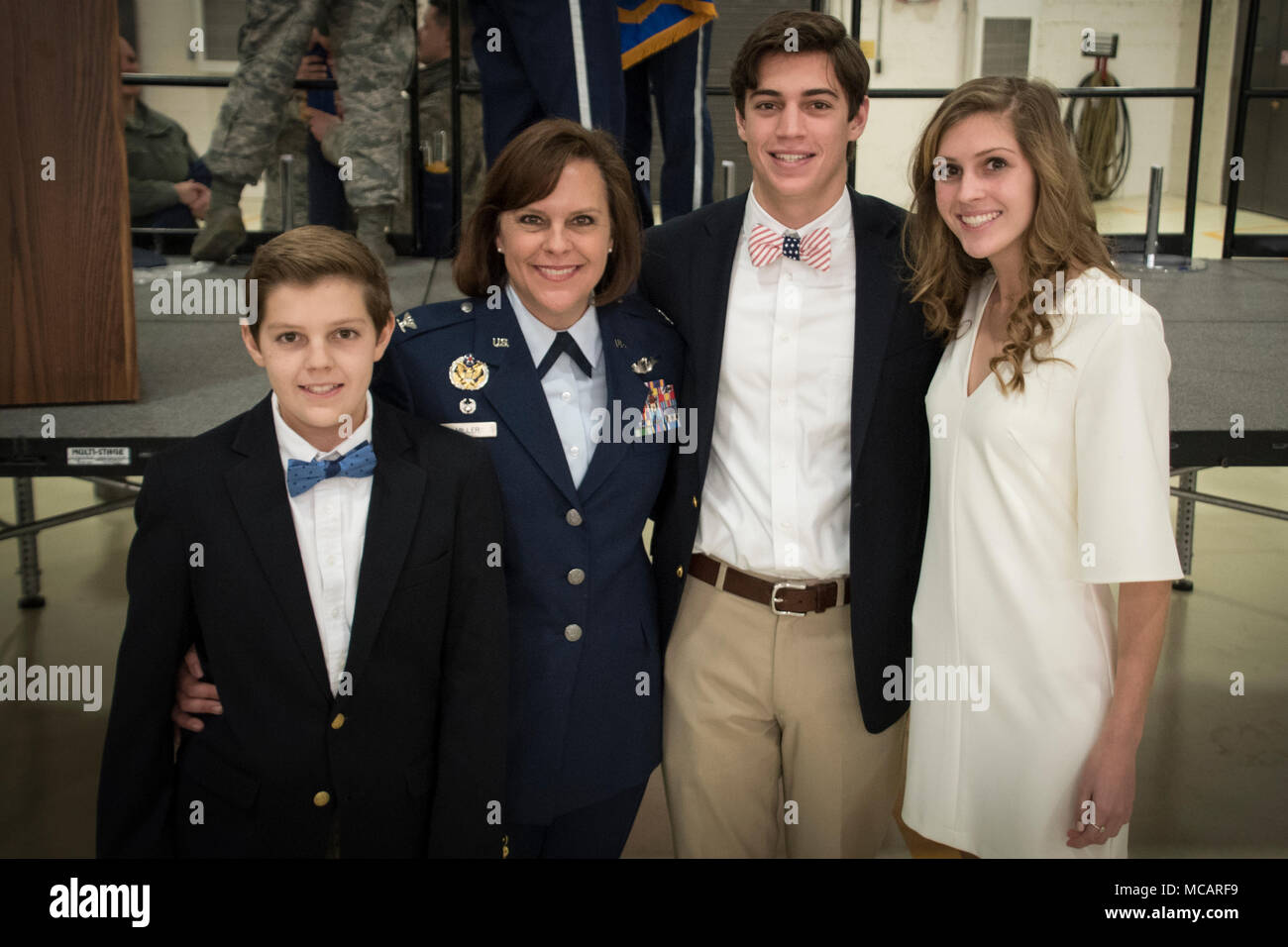 Col. Allison Miller stands with her three children after the Assumption ...