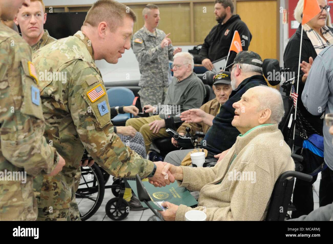 Officer candidate Jonathan Ohearn shakes the hand of Navy Chief Warrant ...