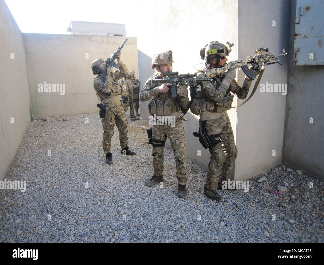 Crisis Response Unit 222 operators prepare to enter a building during a ...