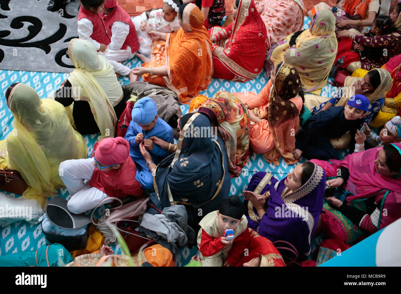 Palma de Mallorca, Spain. April 15, 2018. Women and sons sit inside a ...