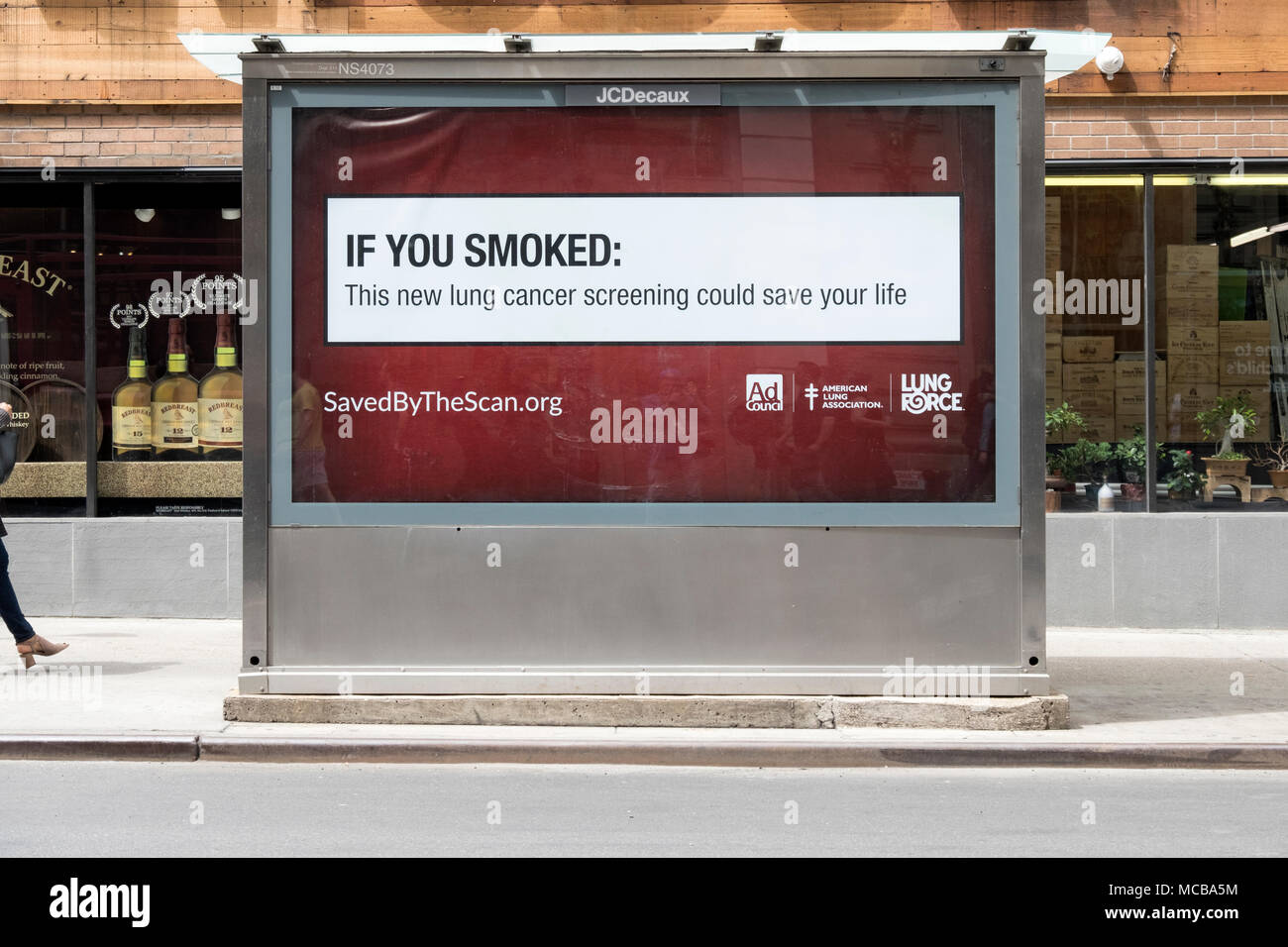 A public health warning sign to smokers & former smokers on the back of ...