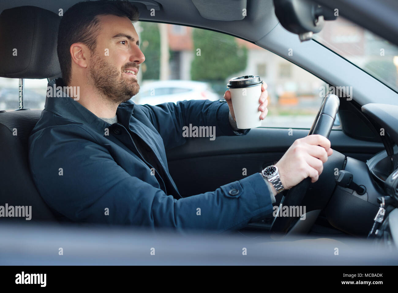 Man drinking coffee driving car hi-res stock photography and images - Alamy