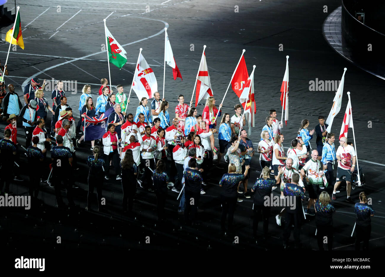 Athletes enter the stadium bearing flags during the Closing Ceremony ...
