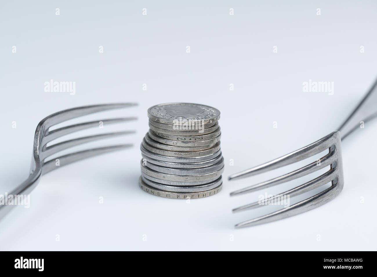 Greedy forks hi-res stock photography and images - Alamy
