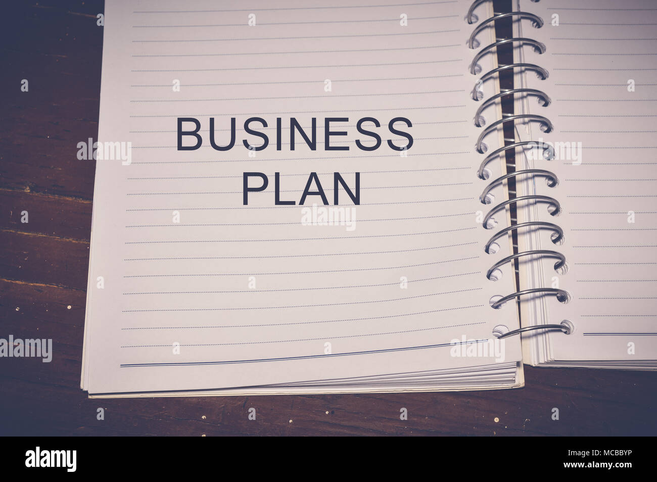 business plan written on white paper Stock Photo - Alamy