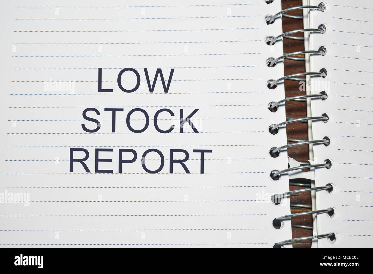 low stock report written on white paper Stock Photo - Alamy
