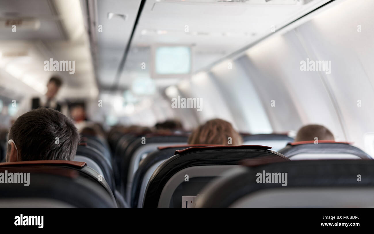 Plane corridor aisle cabin passengers hi-res stock photography and ...