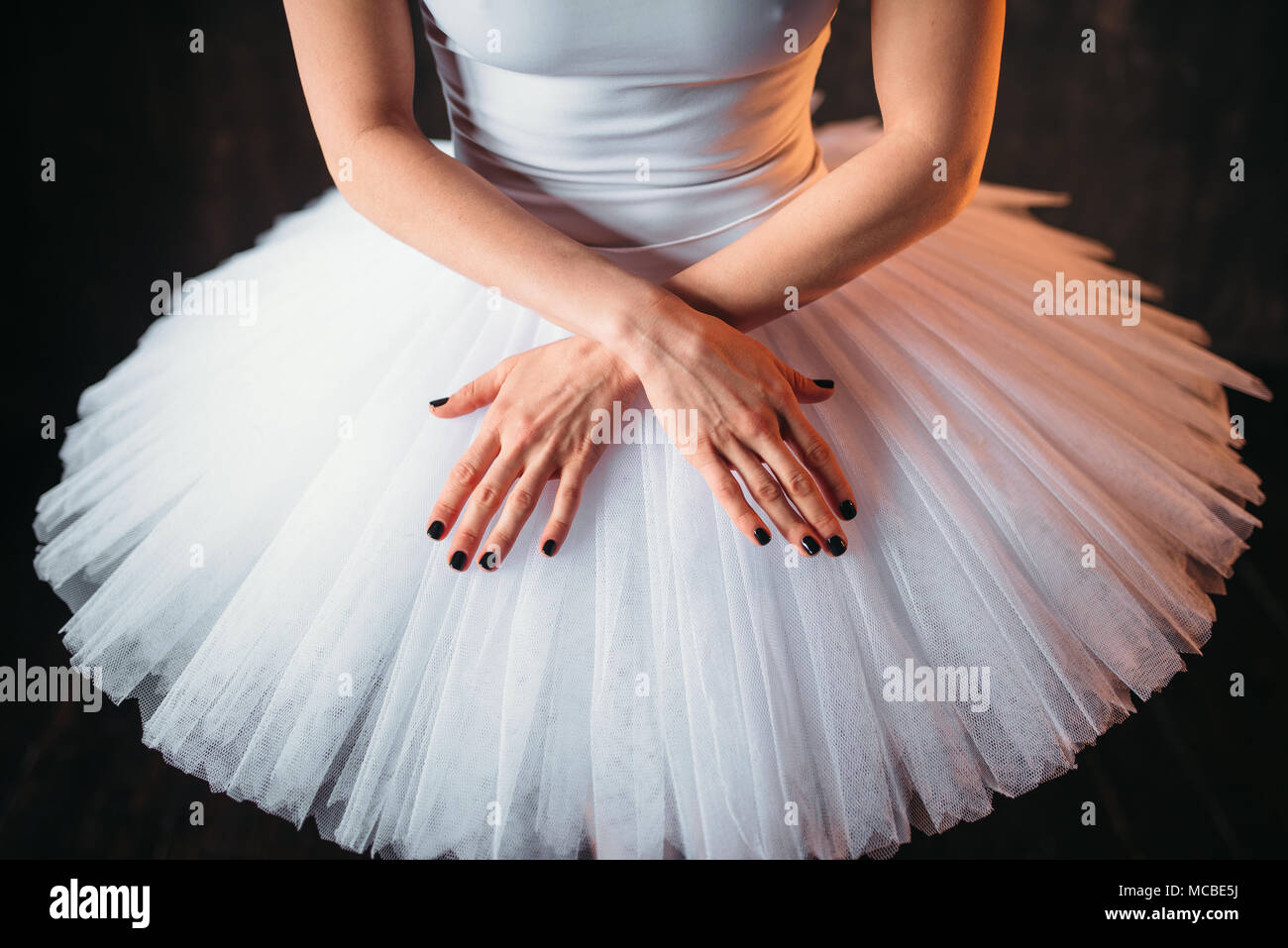 Classical ballet dancer in dress and cross hands Stock Photo - Alamy