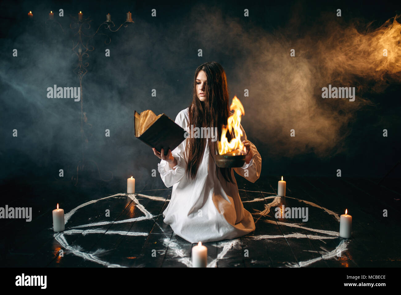 Witch in pentagram circle, dark magic ritual Stock Photo - Alamy