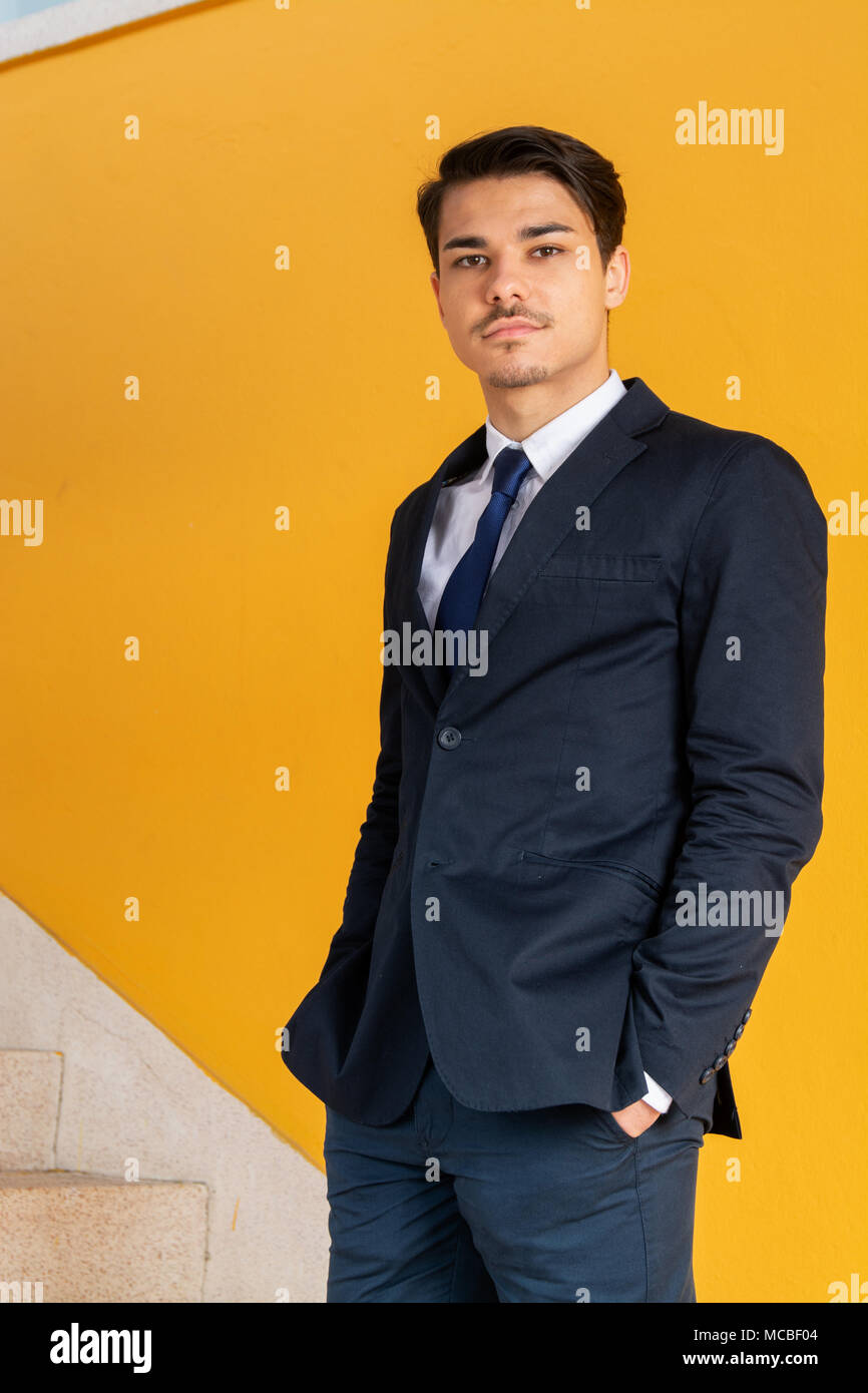 Portrait of a businessman behind wall hi-res stock photography and ...