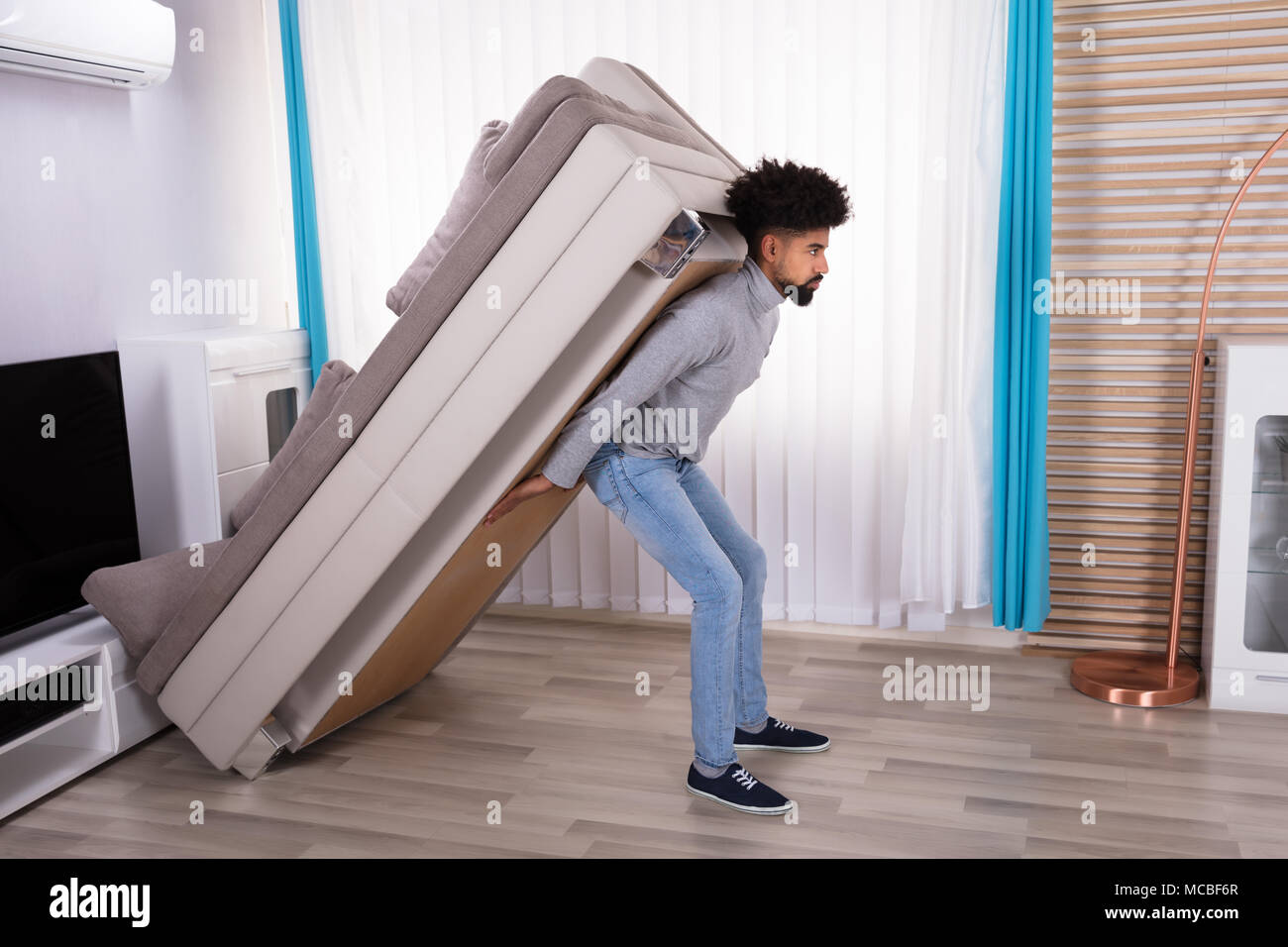 Lifting Tv Stock Photos & Lifting Tv Stock Images - Alamy