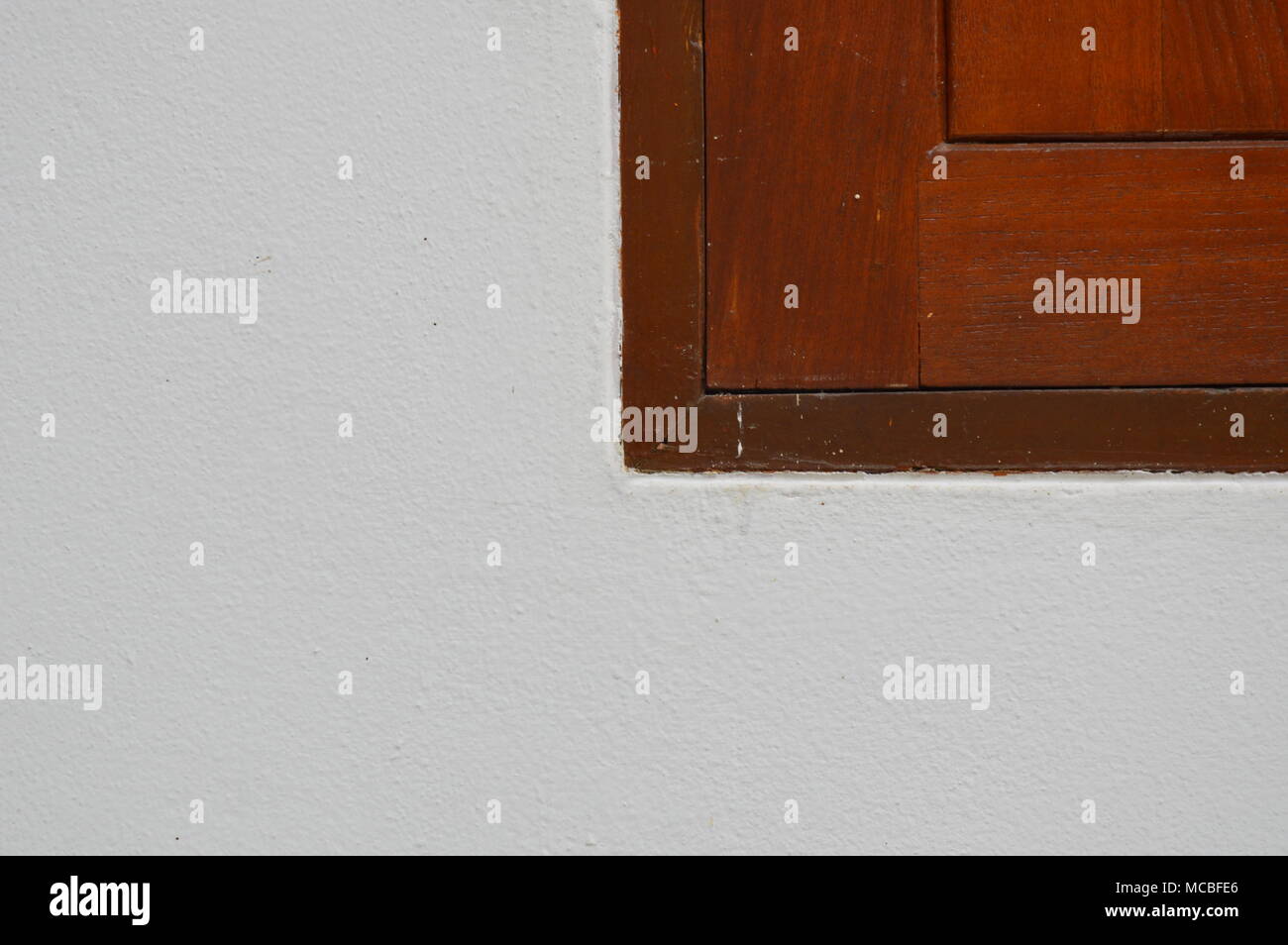 wooden window corner on white building wall Stock Photo - Alamy