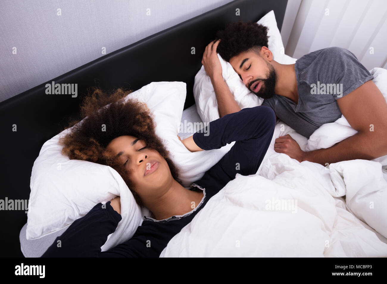 Woman man bed ears hi-res stock photography and images - Alamy