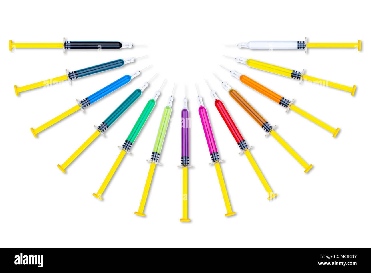 Multiple syringes with needles, filled with various colours of medicine ...