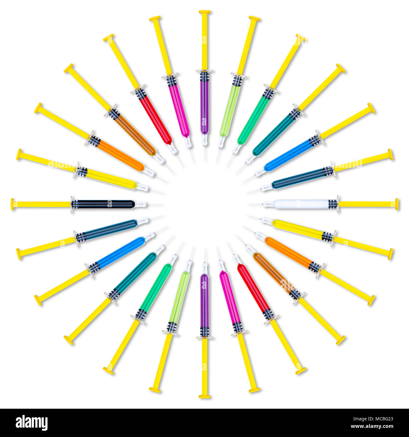 Multiple syringes with needles, filled with various colours of medicine ...