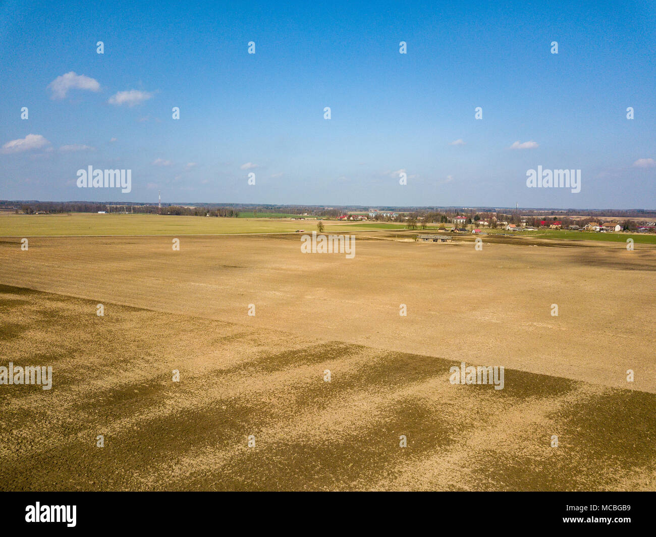 drone image. aerial view of wet cultivated agriculture fields near ...