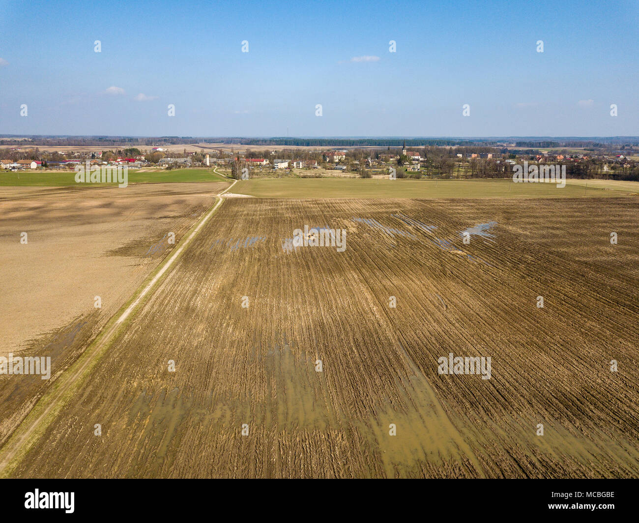 drone image. aerial view of wet cultivated agriculture fields near ...
