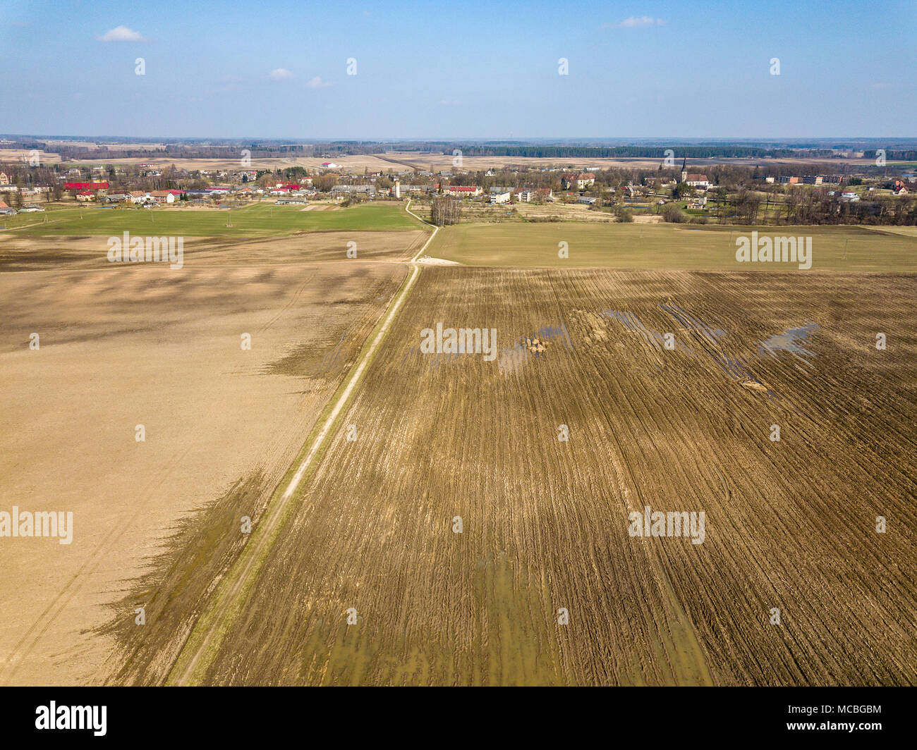 drone image. aerial view of wet cultivated agriculture fields near ...