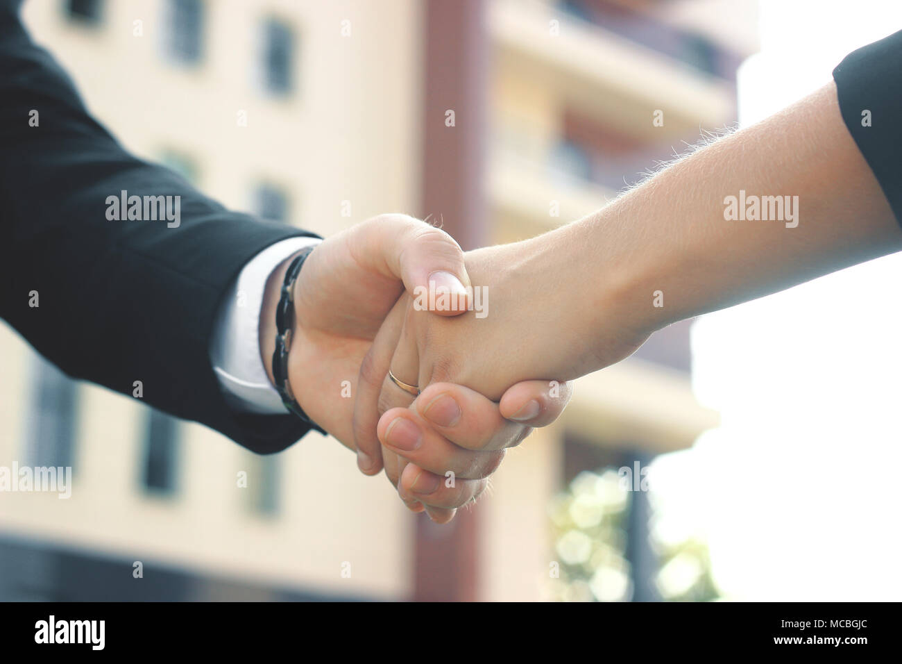 close up. the handshake business partners in the outdoors.photo with ...