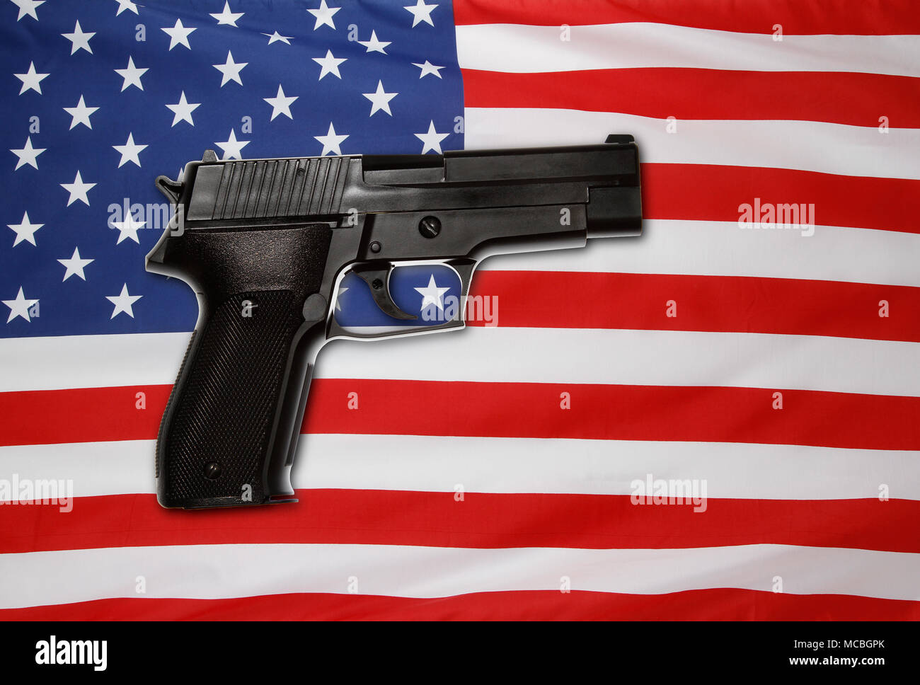 Handgun in front of American flag Stock Photo - Alamy