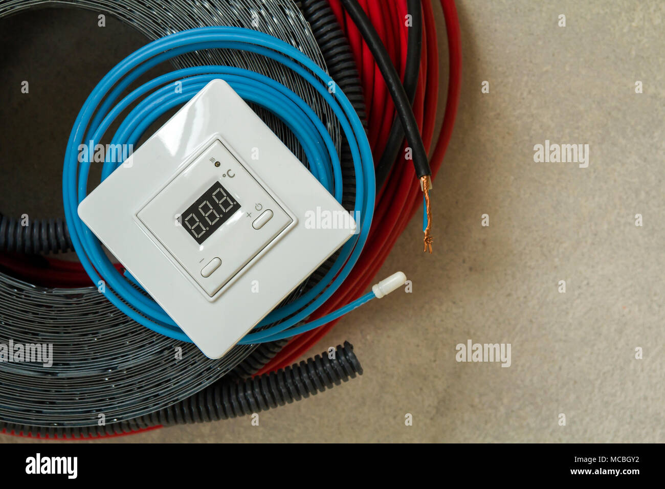 Heating floor system wires, cables and control panel. Renovation and ...