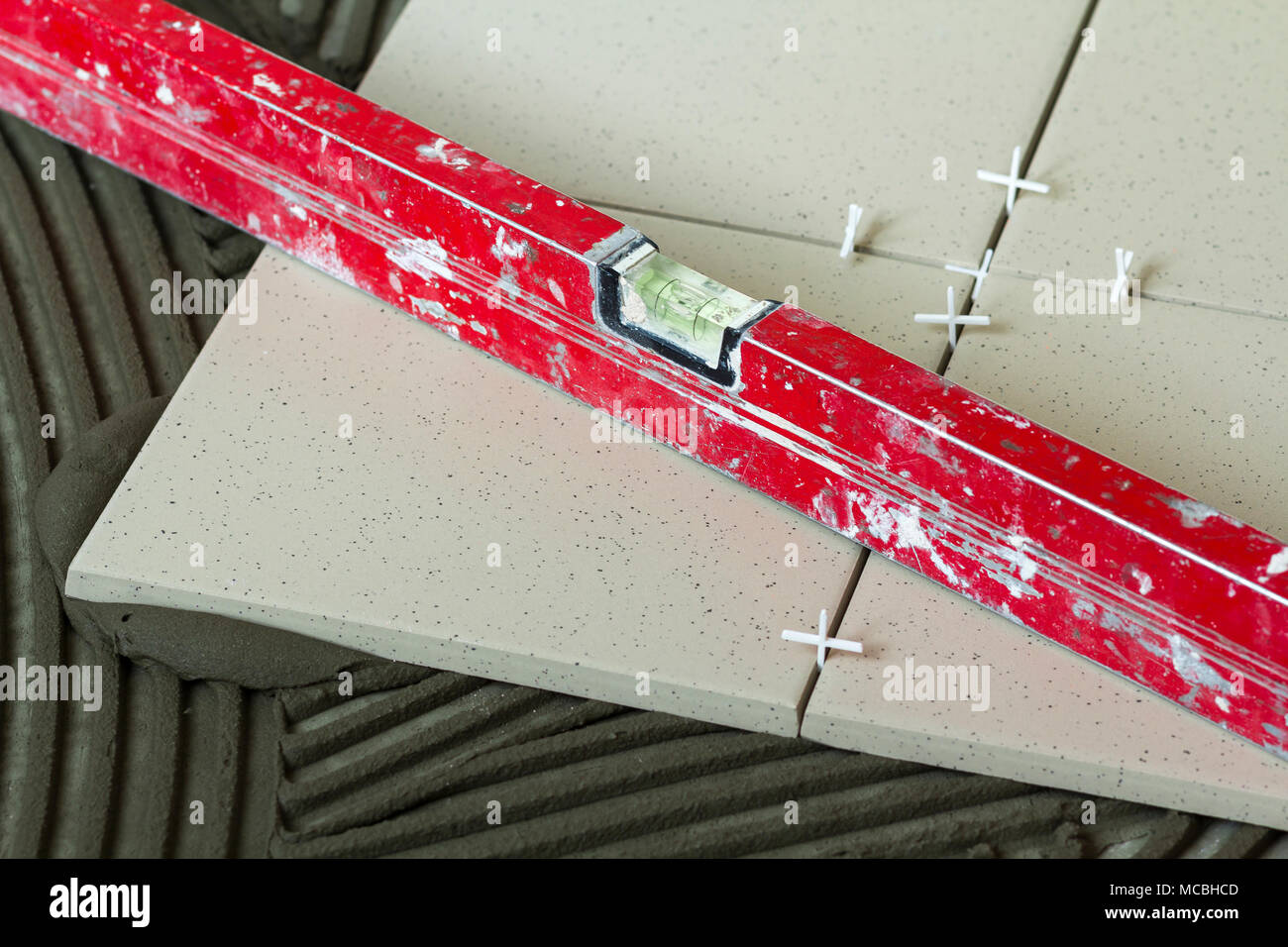 Ceramic tiles and tools for tiler. Floor tiles installation. Home ...