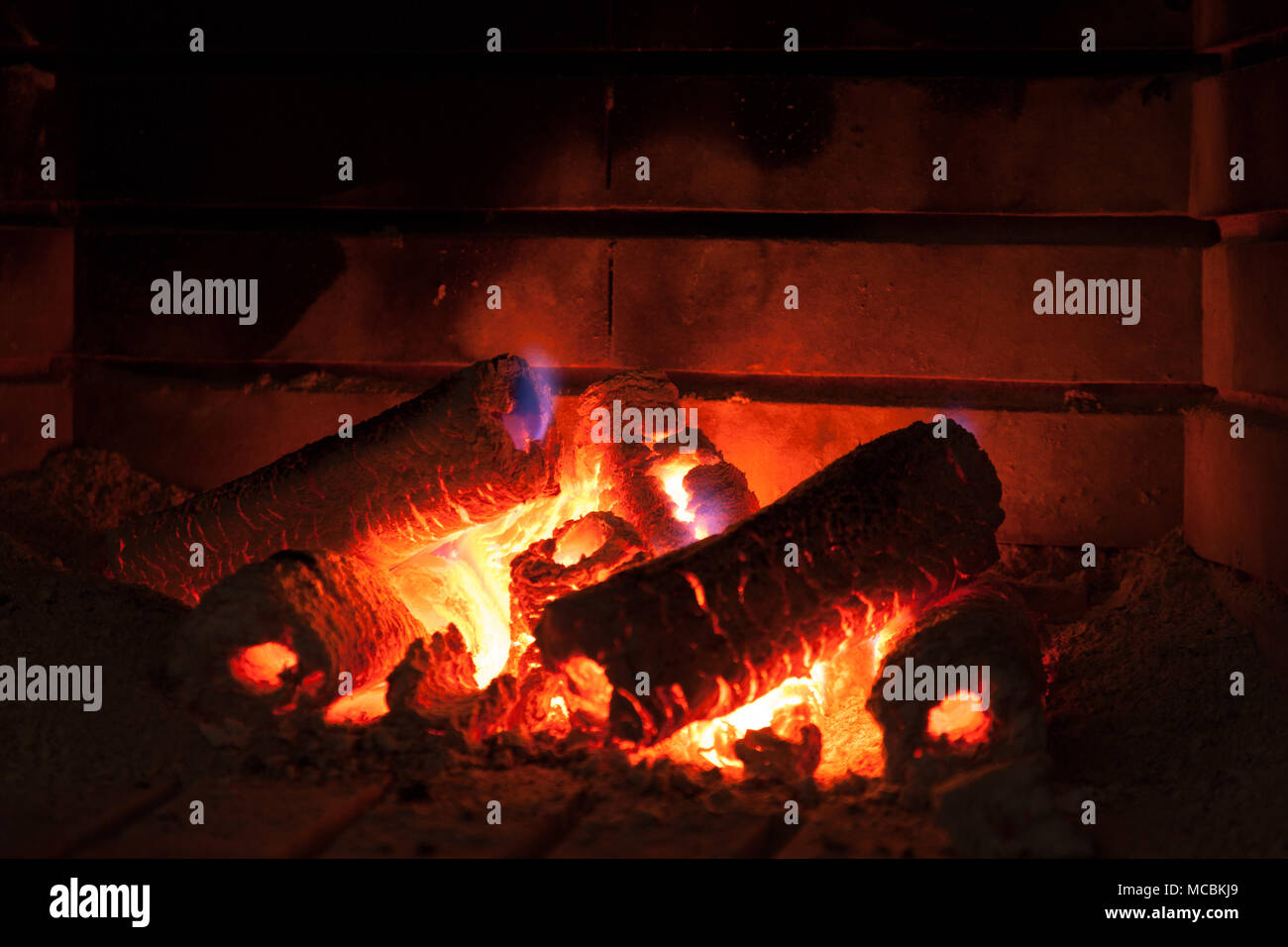 Logs burning in Fireplace Stock Photo - Alamy